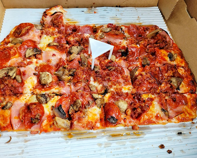 Square-cut pizza perfection – this sausage and pepperoni masterpiece proves that in Ohio, thinking inside the box yields delicious results.