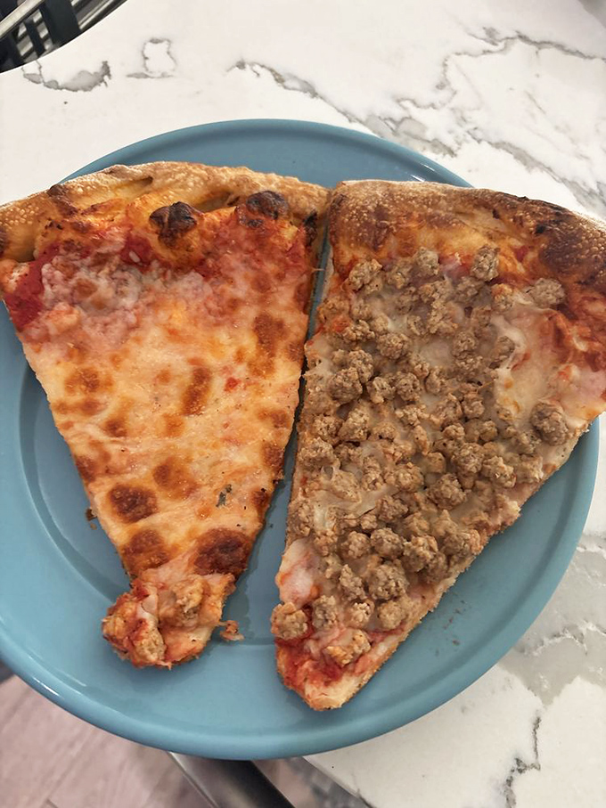 The eternal debate: plain or sausage? At San Lucas, both options win with that gorgeous caramelization and perfect cheese-to-meat ratio.