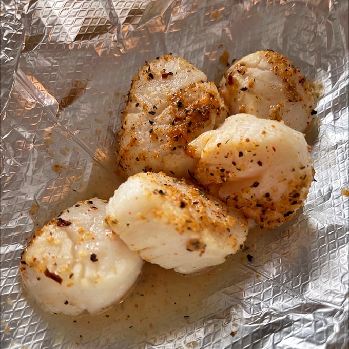 Perfectly seared scallops that would make a French chef weep with joy. Sweet, buttery medallions with a caramelized crust worth driving hours for.