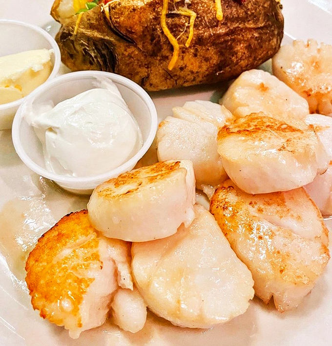 These scallops have achieved what we all aspire to: perfectly golden on the outside while maintaining their inner dignity. The baked potato stands by, a loyal sidekick.