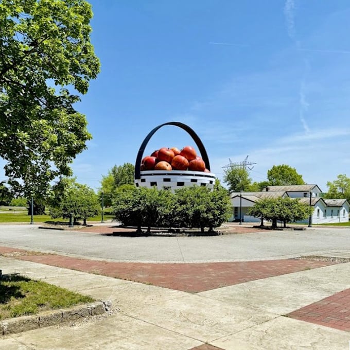 Blue skies make the perfect backdrop for this roadside wonder, where the basket's handle arcs dramatically like a rainbow made of wood.