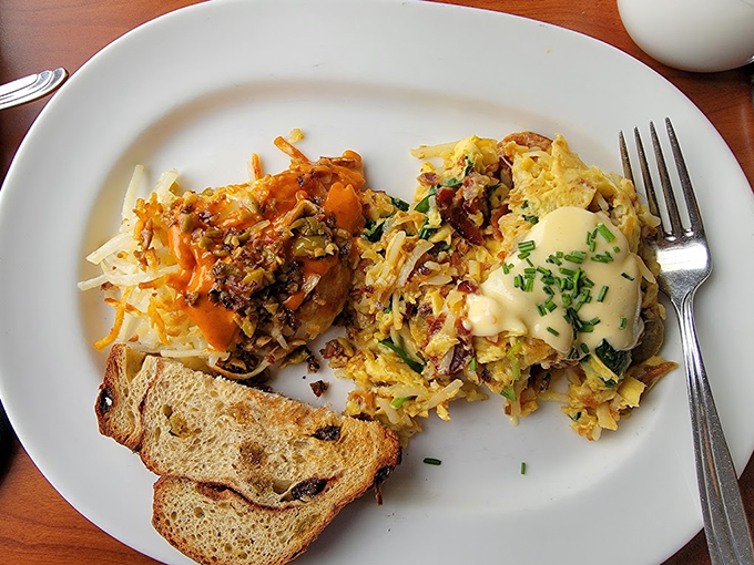 Breakfast architecture at its finest. Those hash browns supporting eggs and hollandaise create the Taj Mahal of morning meals &ndash; beautiful, complex, and absolutely worth the journey.