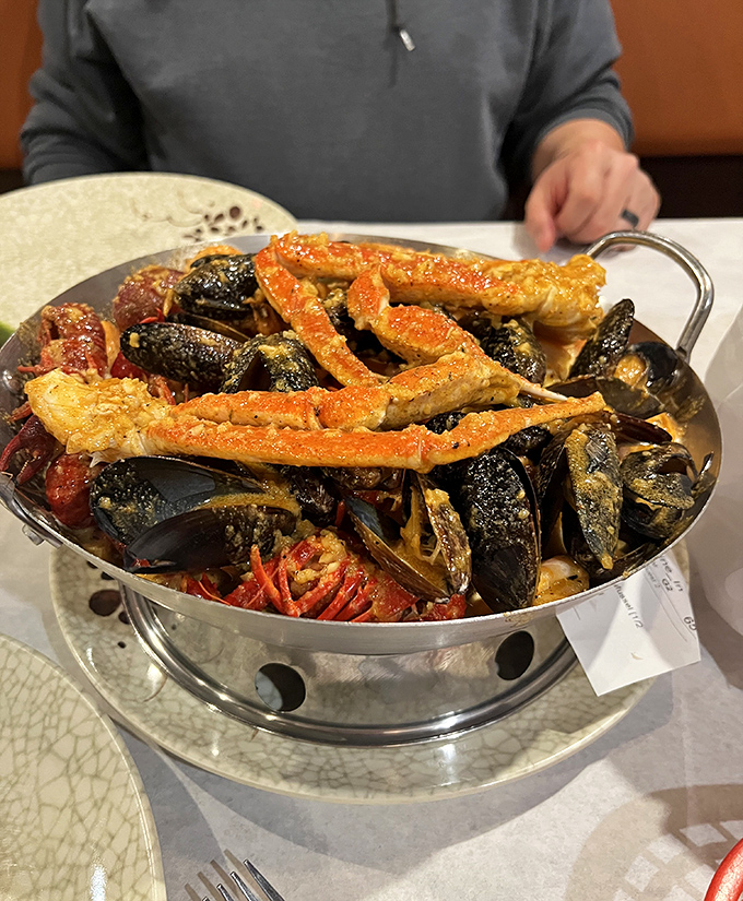 A seafood boil that's practically a treasure chest&mdash;crab legs, mussels, and more, all glistening with seasoned goodness.