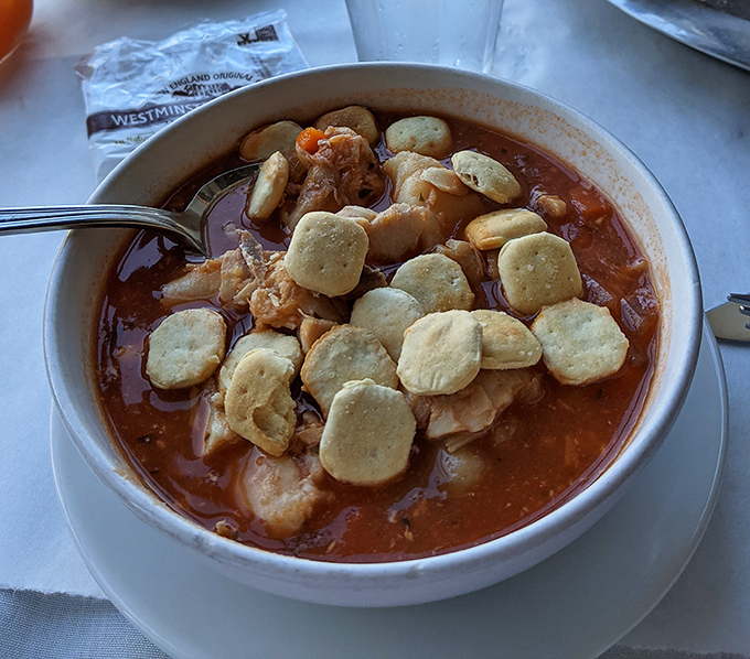 A bowl of seafood chowder topped with oyster crackers&mdash;comfort food that tastes like the ocean gave you a warm hug.