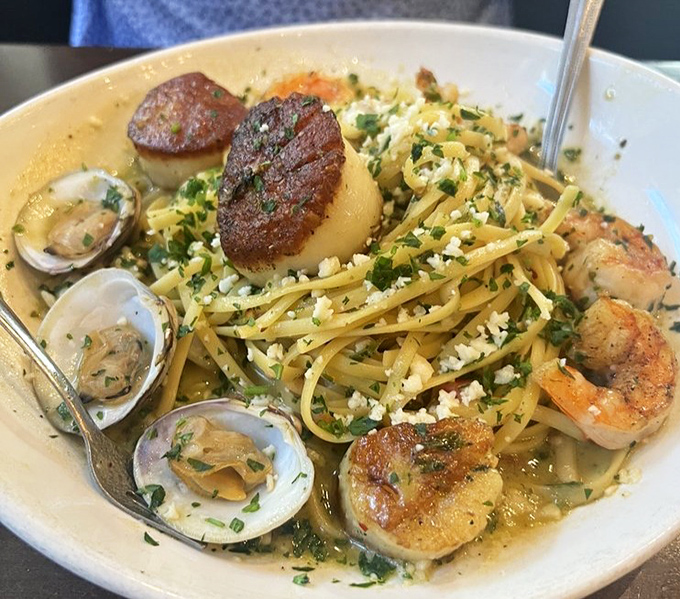 Seafood linguine that would make an Italian grandmother nod in approval &ndash; perfectly seared scallops, tender clams, and al dente pasta.