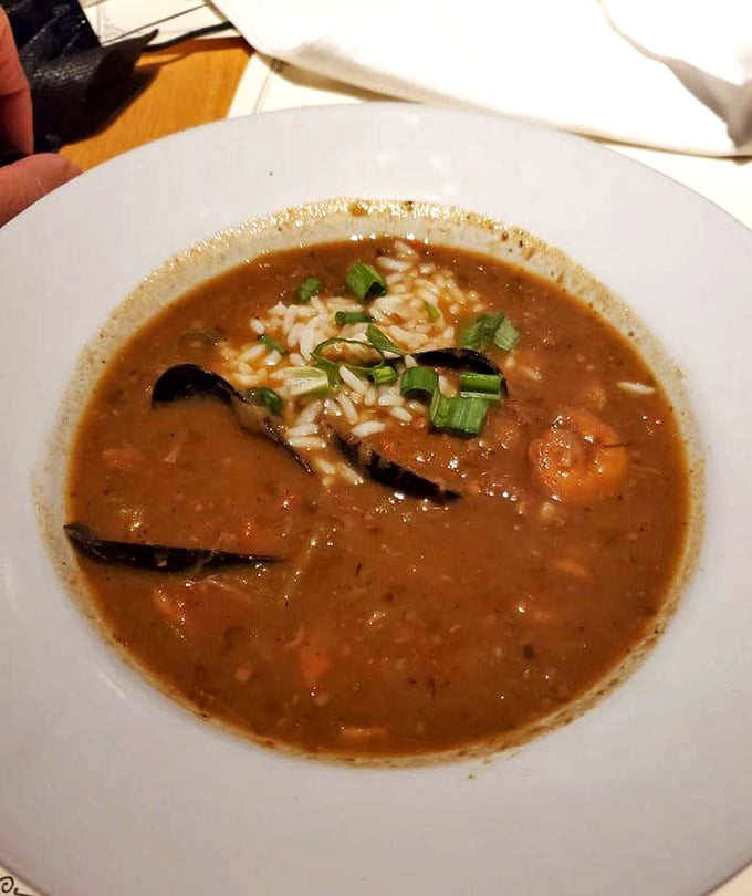 A bowl of gumbo that would make New Orleans proud&mdash;rich roux, tender seafood, and rice that's soaking up all that bayou goodness.