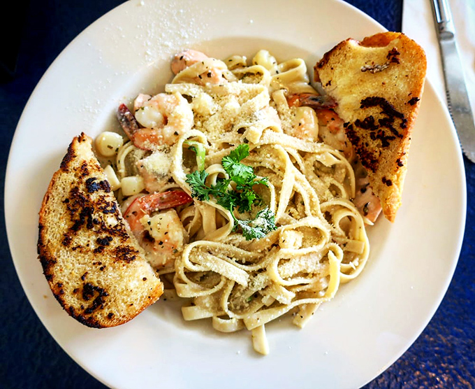 Seafood pasta so loaded, you'll need a treasure map to find all the hidden gems lurking within.