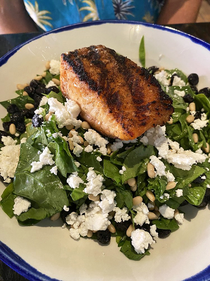 This isn't just salmon on salad &ndash; it's a perfectly seared piece of Alaska perched atop a bed of greens like it's surveying its delicious kingdom.