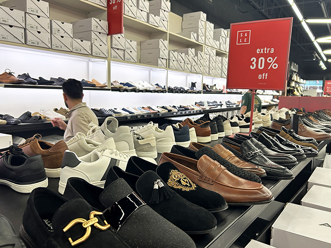 The shoe department: where sensible shopping plans go to die. That "extra 30% off" sign is retail sorcery that somehow makes buying three pairs seem financially responsible.