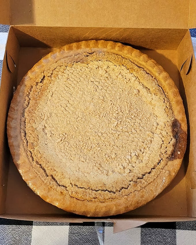 Behold the legendary shoo-fly pie with its signature crumb topping that screams "comfort food royalty" from every layer.
