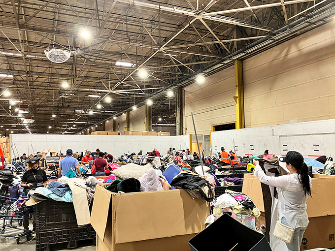 The staging area before the great bin migration. Like paleontologists at a dig site, staff prepare the next round of potential discoveries.