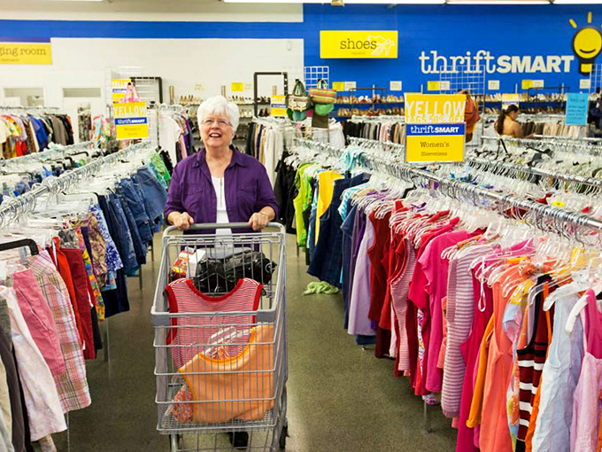 Shopping carts become vessels of possibility as customers navigate aisles of color-coded clothing with the focus of professional treasure hunters.