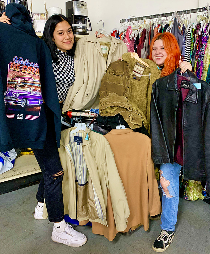 Happy treasure hunters showcase their latest discoveries - proof that thrift shopping brings genuine joy to shoppers.