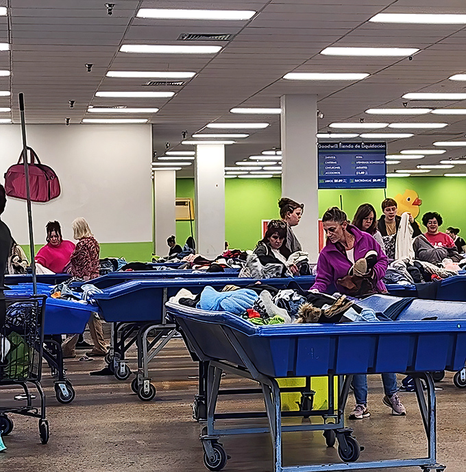 The blue bin brigade in full treasure-hunting mode. Like archaeologists at a dig site, these seasoned shoppers know exactly what they're looking for.