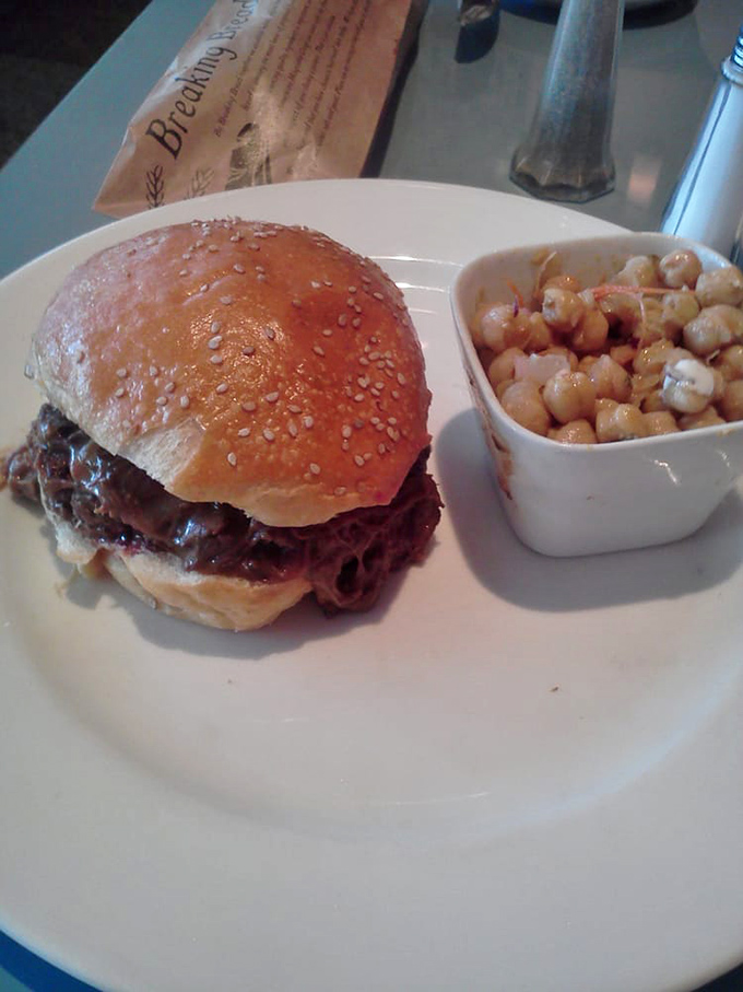 Short rib burger perfection with a side of mac salad &ndash; proof that comfort food can transcend to art form without losing its soul.