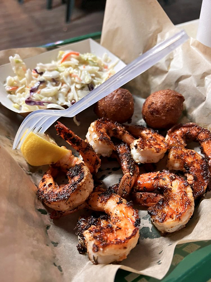 Blackened shrimp that wear their seasoning like a badge of honor, alongside coleslaw that cuts through the spice just right.