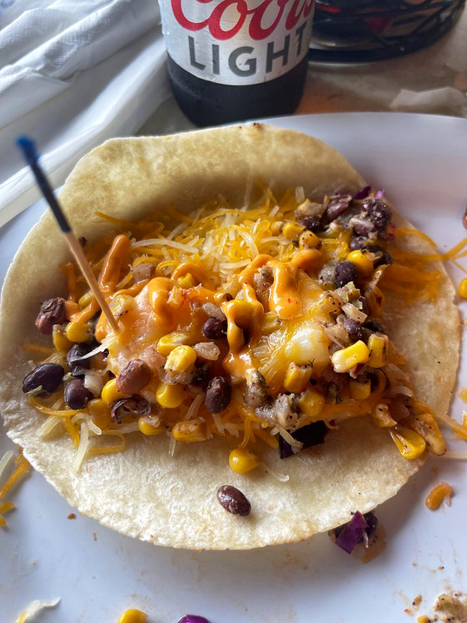 Whoever said "don't play with your food" never encountered this taco &ndash; a fiesta of black beans, corn, and cheese that demands to be celebrated.