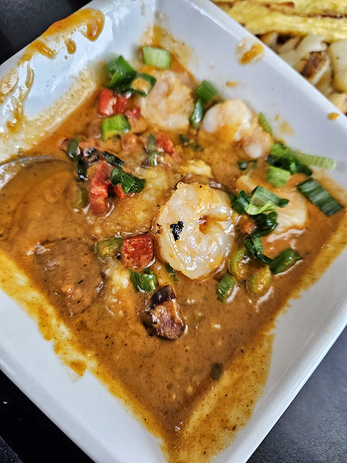 Shrimp and grits that would make a Southerner weep with joy&mdash;plump shrimp swimming in savory goodness with green onions standing guard. 