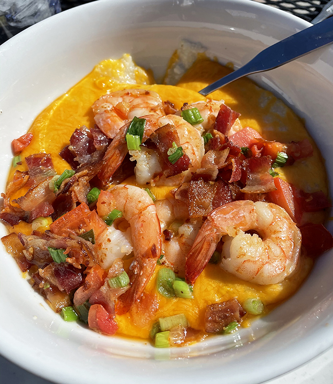 Shrimp and grits elevated to an art form. Those plump Gulf shrimp nestled on creamy cheese grits with bacon could convert any seafood skeptic.