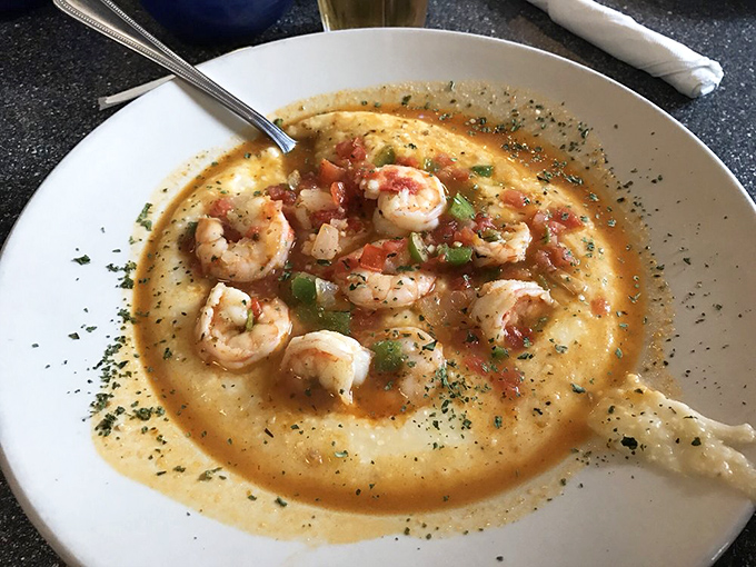 These shrimp and grits aren't just a meal, they're a Southern revelation – creamy cornmeal topped with plump shrimp in a sauce worth bottling.