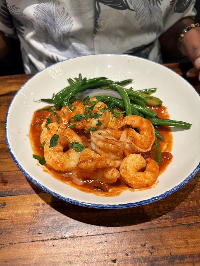 Plump Gulf shrimp swimming in savory sauce alongside fresh green beans. Not sharing this dish could be grounds for divorce in some states.