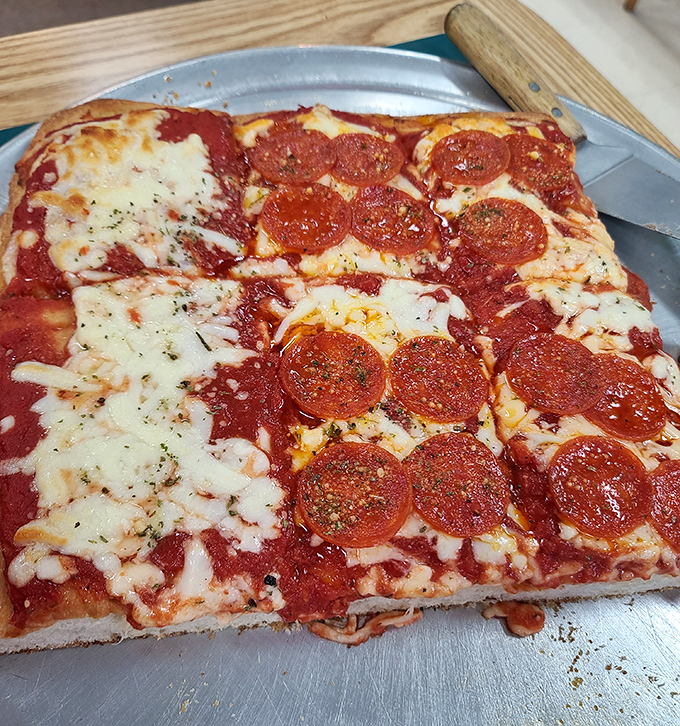 Sicilian pizza that doesn't mess around &ndash; thick, square-cut perfection with pepperoni that curls into little flavor cups. This is pizza with purpose.