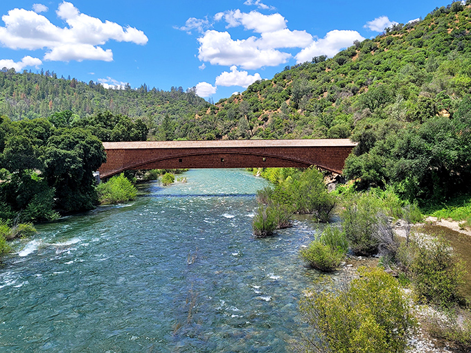 Nature's perfect frame: crystal-clear waters of the South Yuba River flowing beneath wooden engineering that's stood the test of time.