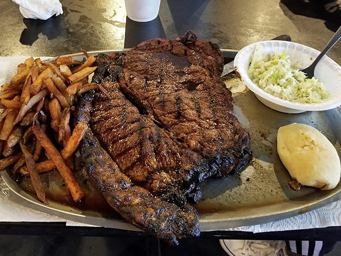 Behold the star of the show: a perfectly charred sirloin with hand-cut fries and coleslaw. This isn't dinner; it's a religious experience.