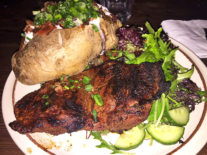 The signature sirloin arrives with grill marks that would make any backyard barbecue master weep with pure envy.