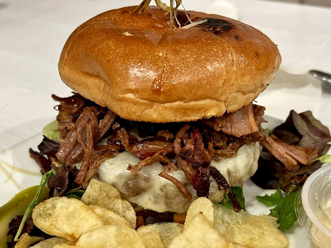 Not your average burger joint creation&mdash;this brisket masterpiece stands tall like the food equivalent of a Pennsylvania barn raising.