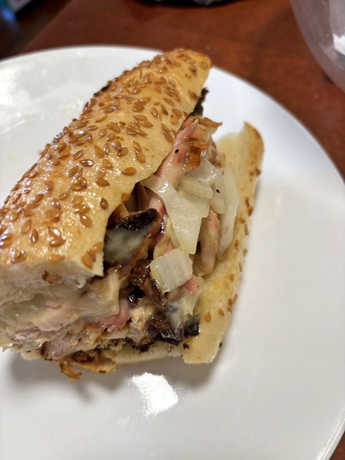 Melted cheese cascades over tender smoked meat in this sandwich that makes you wonder why all cheesesteaks aren't made this way.