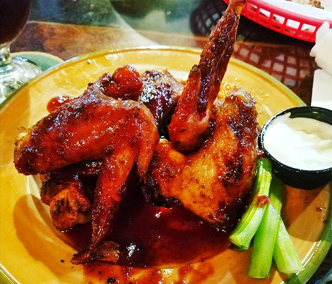 Wings that have clearly been introduced to smoke before meeting sauce. That glistening glaze isn't just for show&mdash;it's flavor you can see.