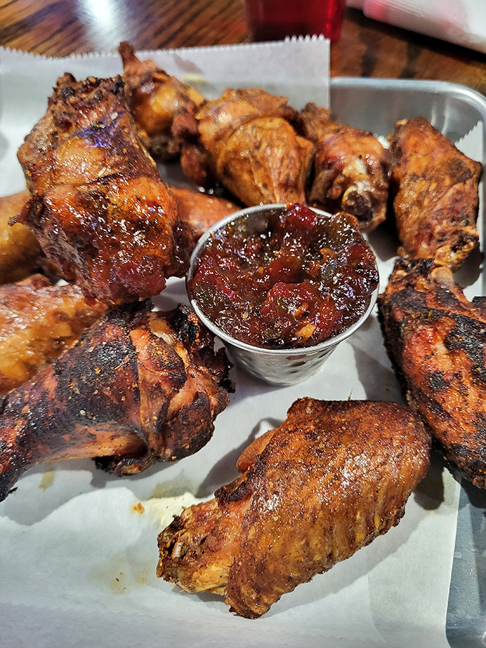 These wings aren't just smoked—they're transformed. The sauce cup in the middle isn't a condiment, it's liquid gold for an already perfect protein.