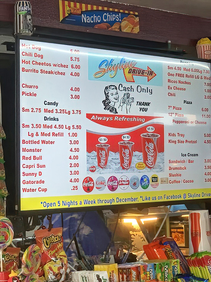 Hot Cheetos with cheese? The menu board reveals drive-in cuisine has evolved beyond just popcorn while keeping prices refreshingly reasonable.
