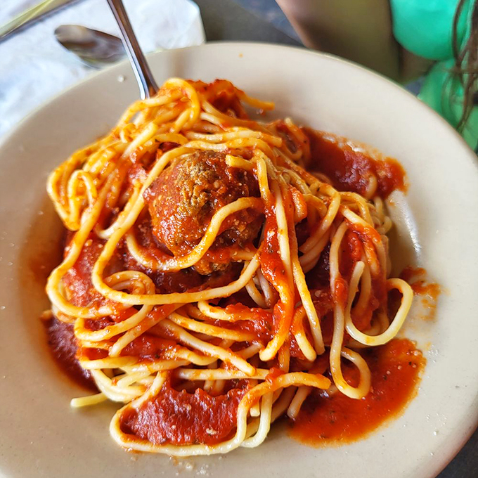 House-made marinara sauce coating fresh pasta with meatballs that would make any Italian grandmother smile approvingly.