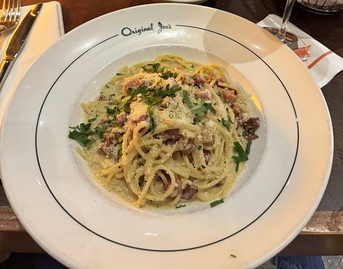 Carbonara done right is a religious experience. This plate of creamy, bacon-studded pasta might just have you speaking in tongues.