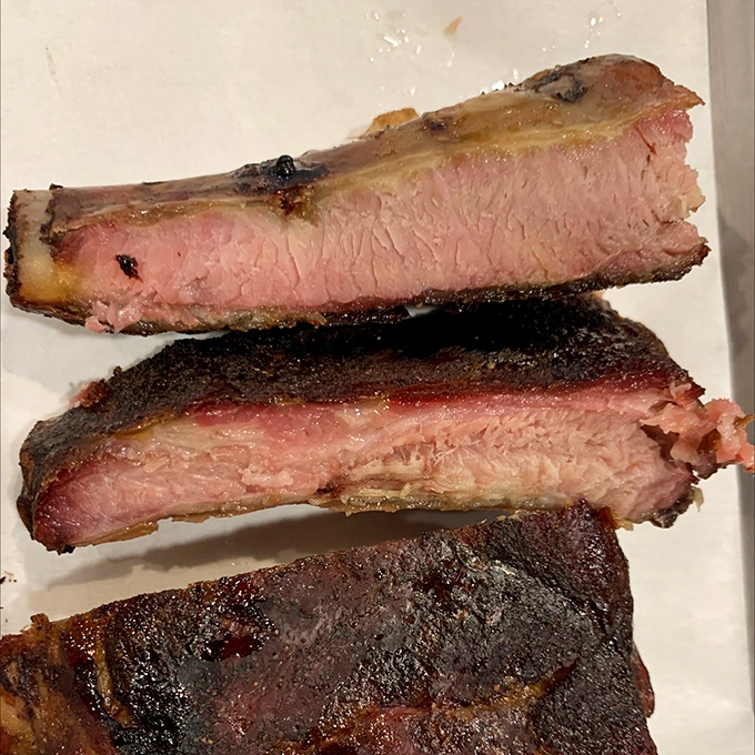 Behold the holy grail of barbecue&mdash;perfectly smoked ribs with that coveted pink smoke ring. The bark on these beauties tells stories of patience and expertise.