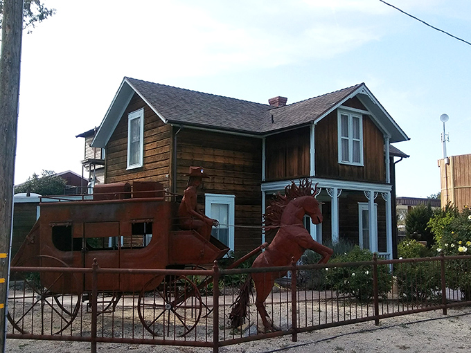 This vintage home with its rusty stagecoach fence art perfectly captures Los Alamos' spirit&mdash;historical charm with a creative wink.