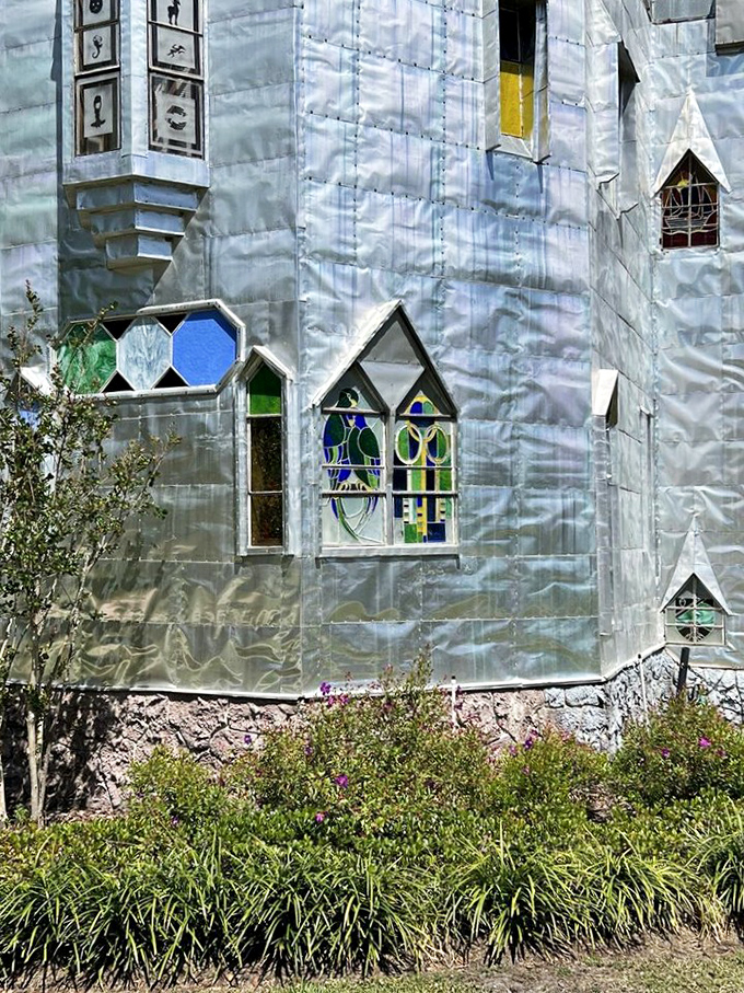 Sunlight streams through handcrafted stained glass windows, transforming ordinary aluminum walls into a kaleidoscope of color and creativity.