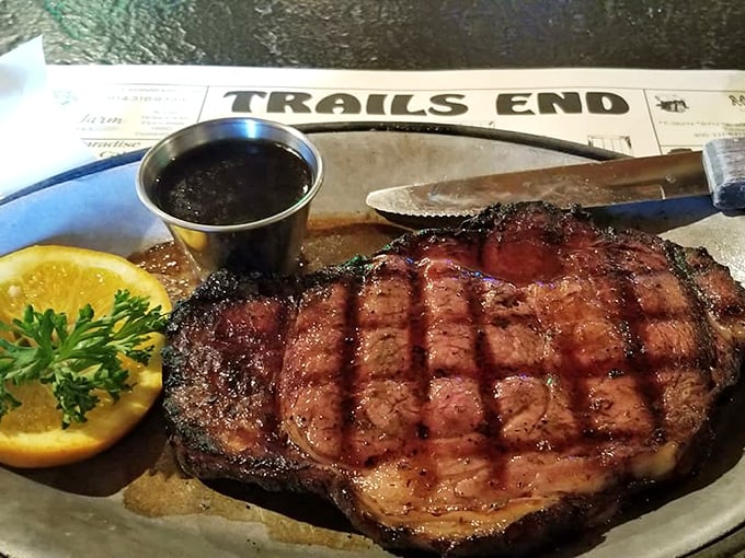 This beautifully grilled steak arrives with that perfect char and pink center that makes carnivores everywhere rejoice.