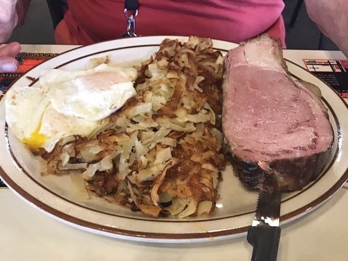 The holy trinity of breakfast perfection: a ham steak with enough heft to satisfy Paul Bunyan, golden hash browns, and eggs sunny-side up.