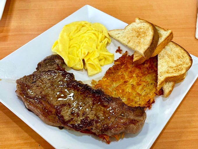 The breakfast of champions—or anyone who believes steak belongs at every meal. Those eggs are sunshine on a plate.