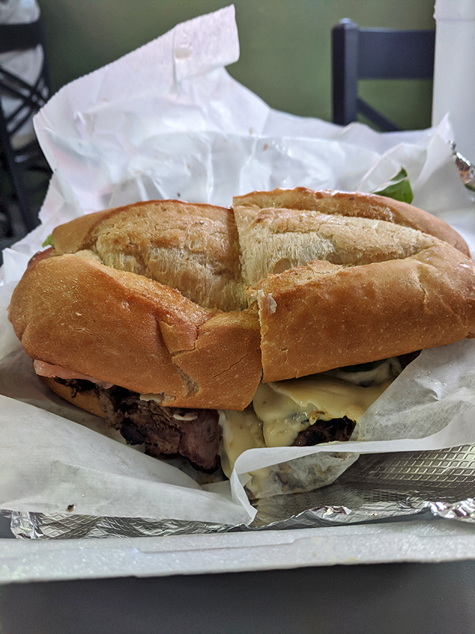 This steak sandwich isn't just lunch; it's a meaty masterpiece on crusty bread that demands both hands and several napkins.