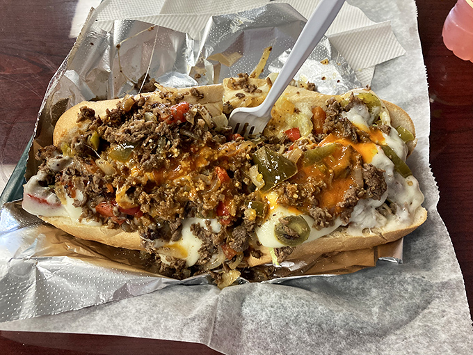 The pepper steak sub in all its glory. Those colorful peppers aren't just garnish—they're like backup singers who occasionally steal the show.