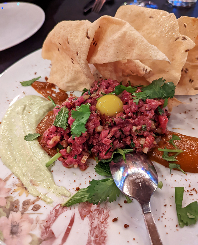 Steak tartare that's dressed to impress with a sunny egg yolk crown. Raw beef never looked so dapper or tasted so divine.