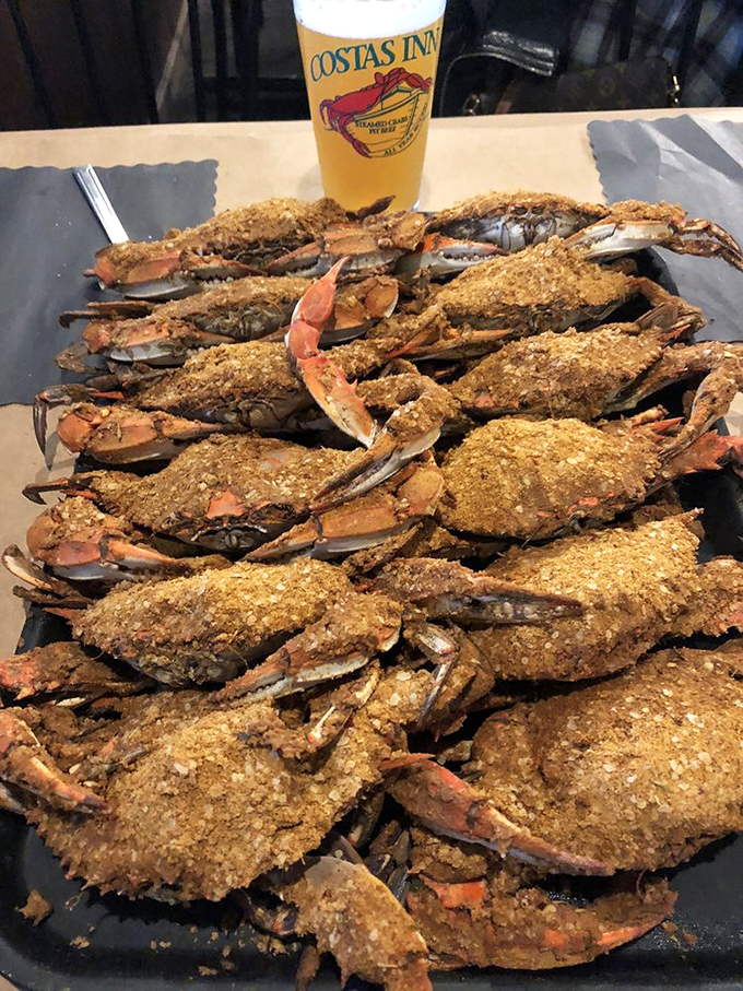 The main event: Old Bay-crusted blue crabs arranged like delicious soldiers, ready for battle with your mallet and your appetite.