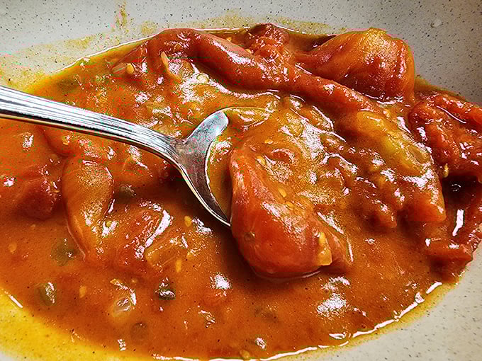 These stewed tomatoes aren't just a side dish; they're summer captured in a bowl, ready to transport you back to simpler times.