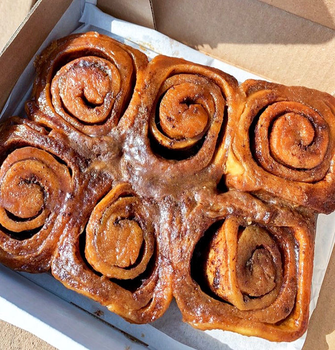 These aren't just sticky buns&mdash;they're edible architecture, with each glossy, caramelized swirl supporting the weight of your expectations perfectly.