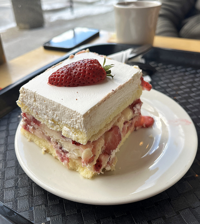 This strawberry cake doesn't just have layers &ndash; it has chapters in a delicious story. The fresh berry garnish is like nature's exclamation point.