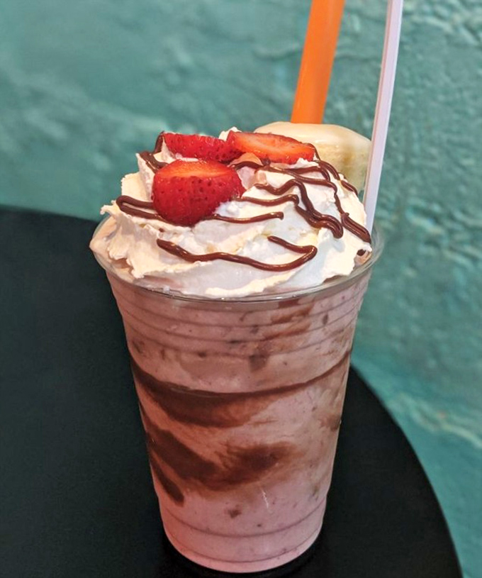 Strawberry fields forever in a cup. This strawberry-chocolate creation topped with fresh berries and whipped cream is what dessert dreams are made of.